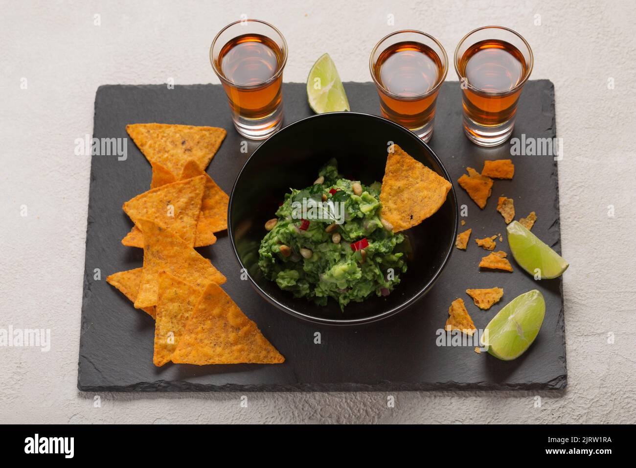 Latinamerican Mexican food party sauce guacamole, salsa, chips, and t ...