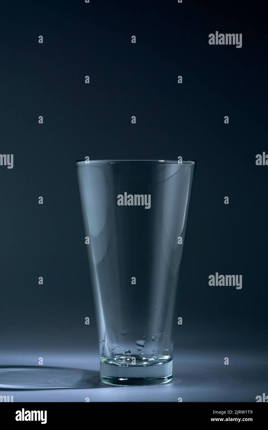 Empty Glass tumbler on black background, still life Stock Photo - Alamy