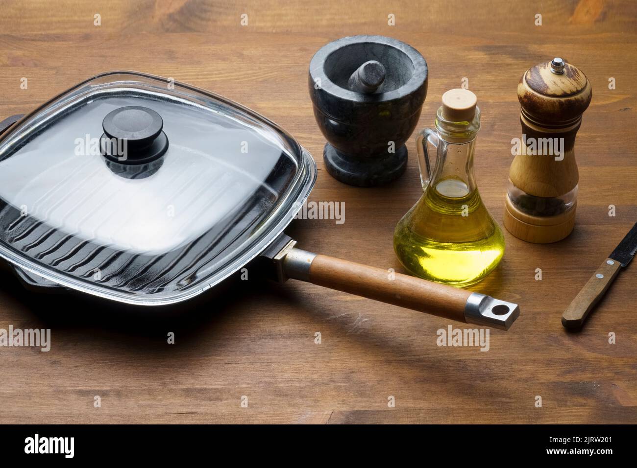 Empty grill for frying meat, sausages and vegetables BBQ, olive oil ...