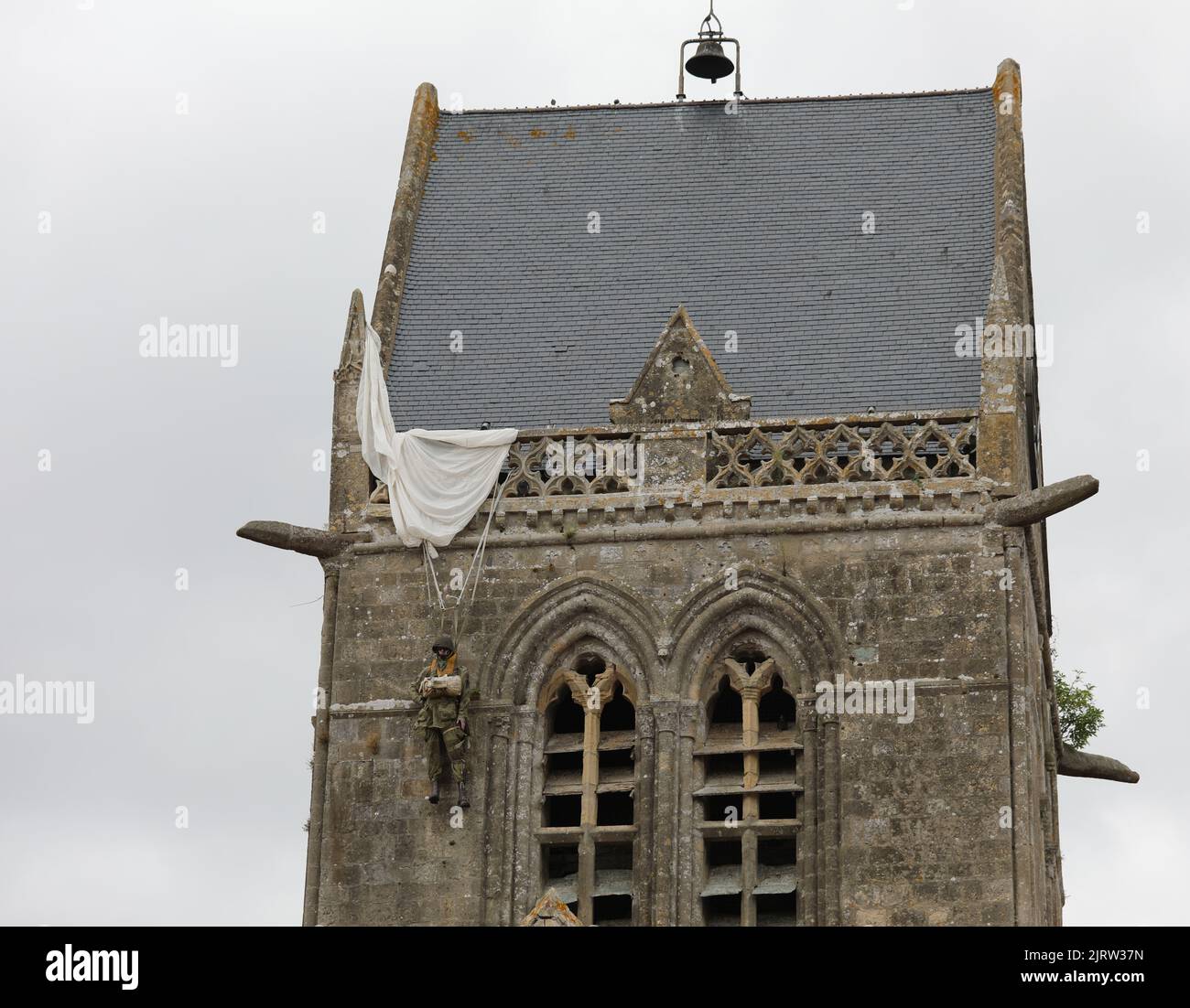 famous bell tower of the French town SAINTE MERE-EGLISE with the ...
