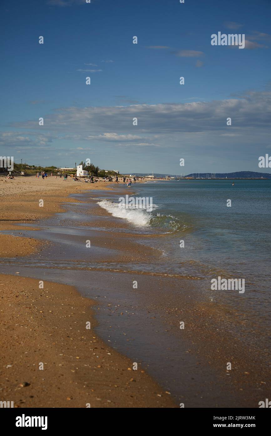 A vertical shot of a sandy beach in Marseillan Plage, Herault, France ...
