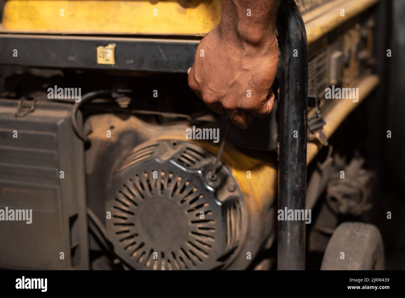 african man starting a generator Stock Photo - Alamy
