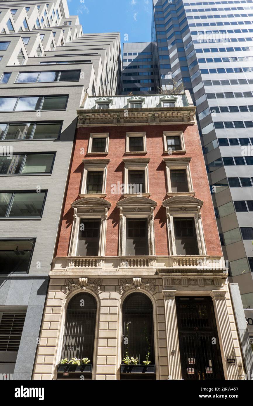 Modern skyscrapers flank the historic Robt. McCurdy Mansion at 39 E ...