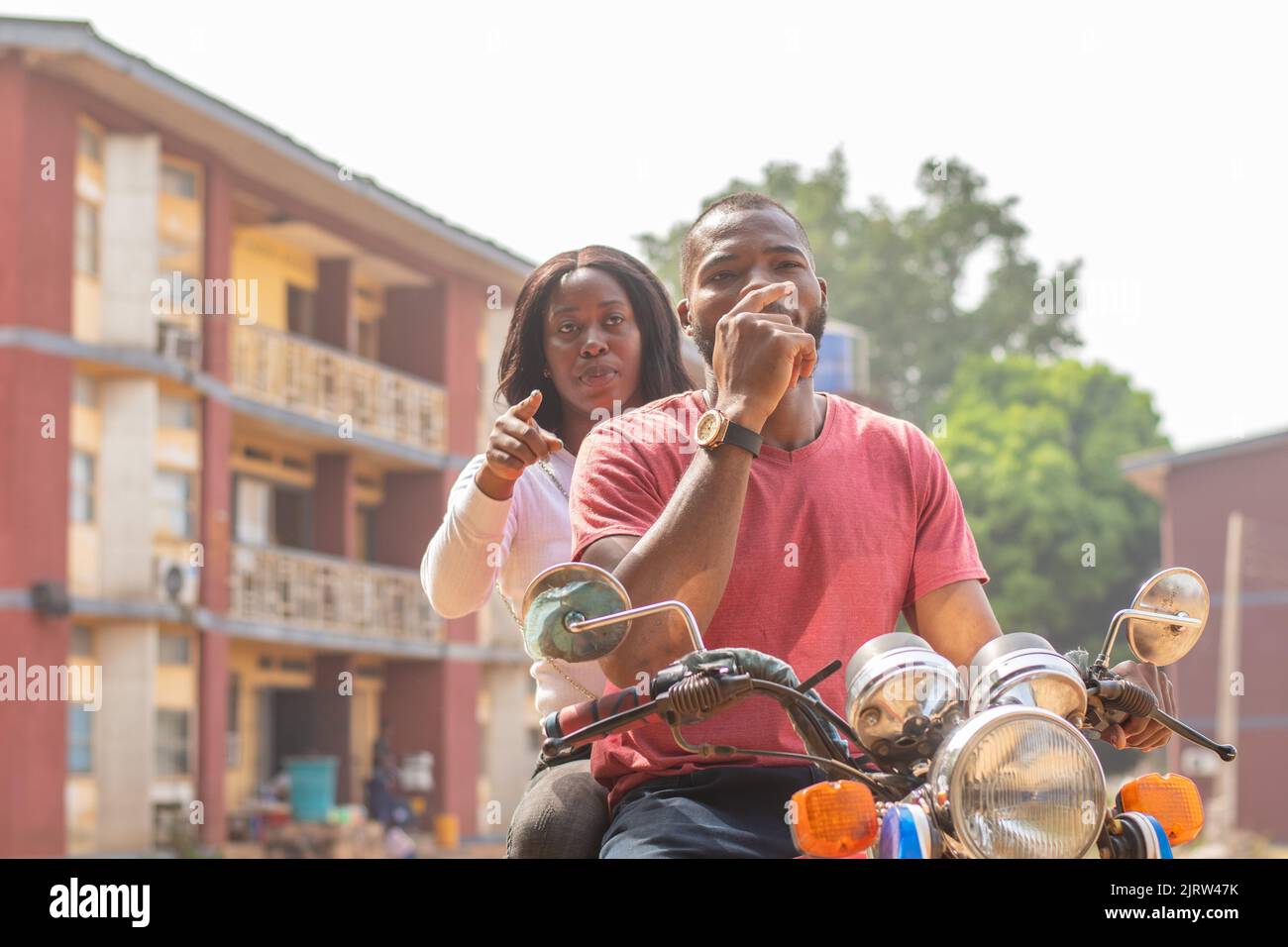 black lady on a bike showing the rider direction to take Stock Photo ...
