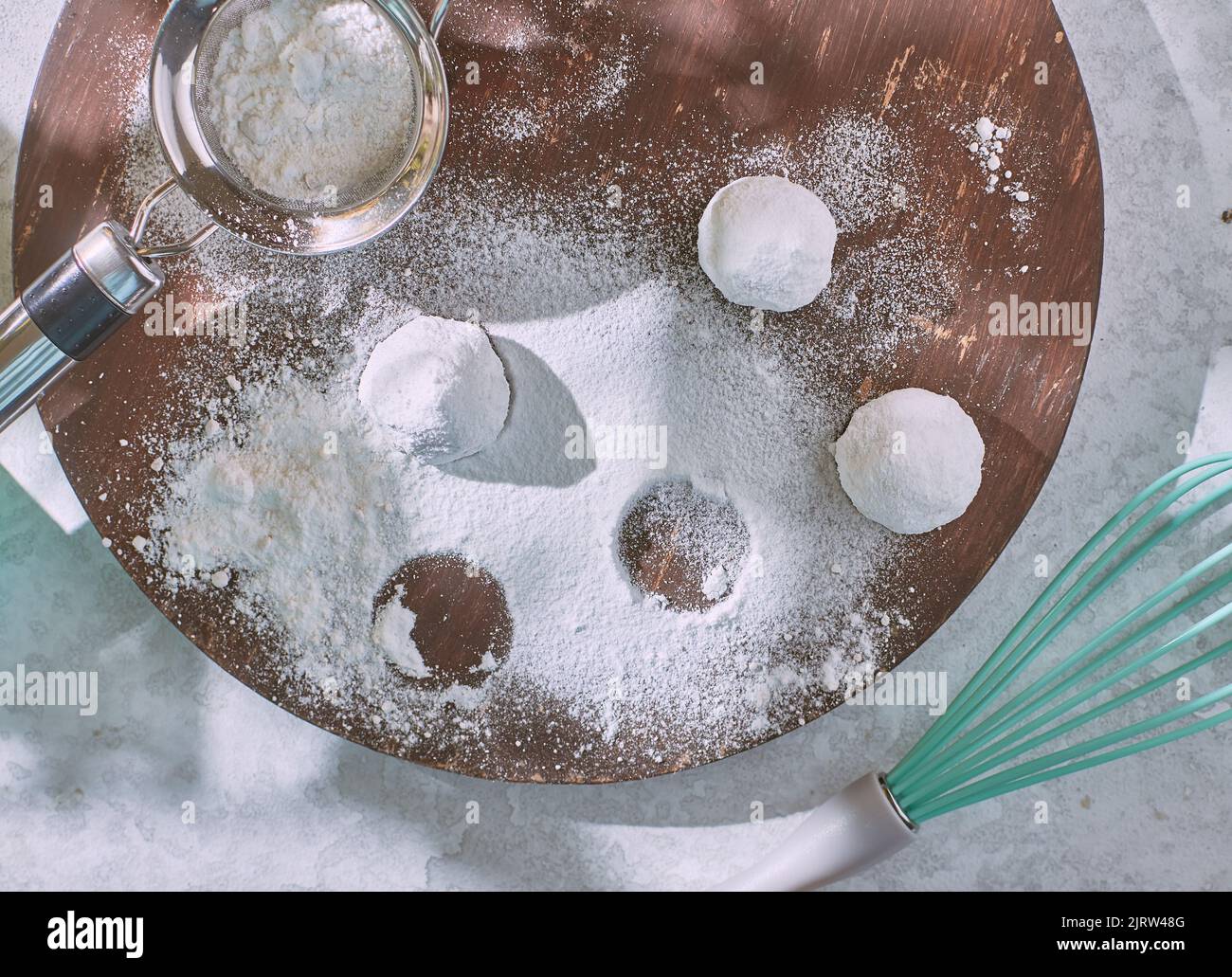 A baking material with cookies on a wooden plate Stock Photo - Alamy