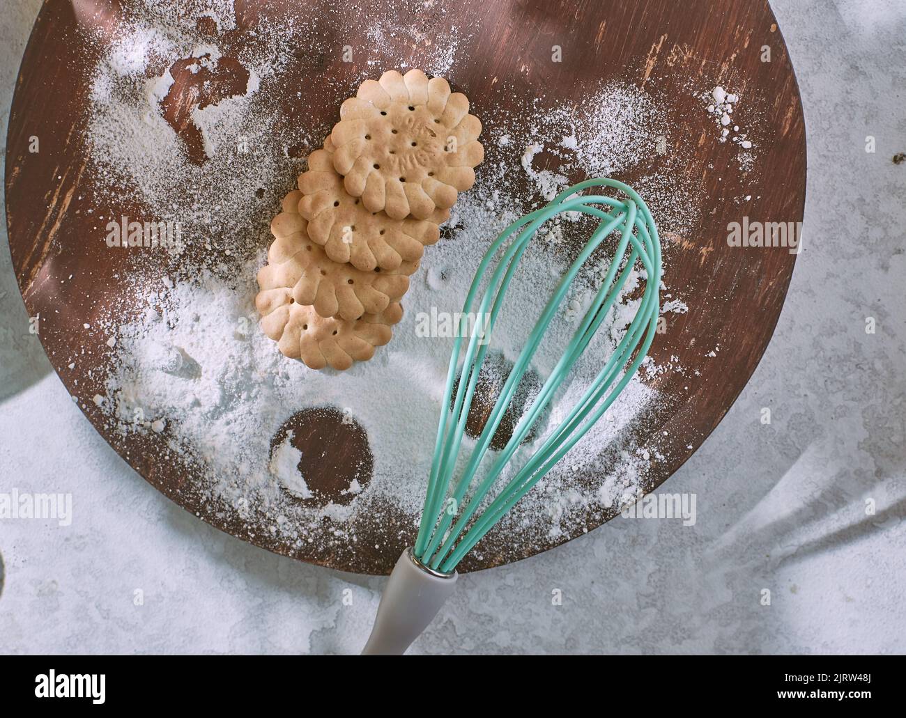 A baking material with cookies on a wooden plate Stock Photo - Alamy