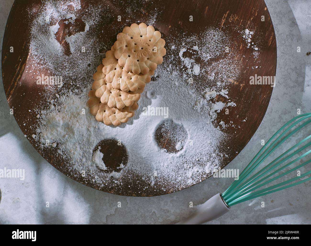 A baking material with cookies on a wooden plate Stock Photo - Alamy