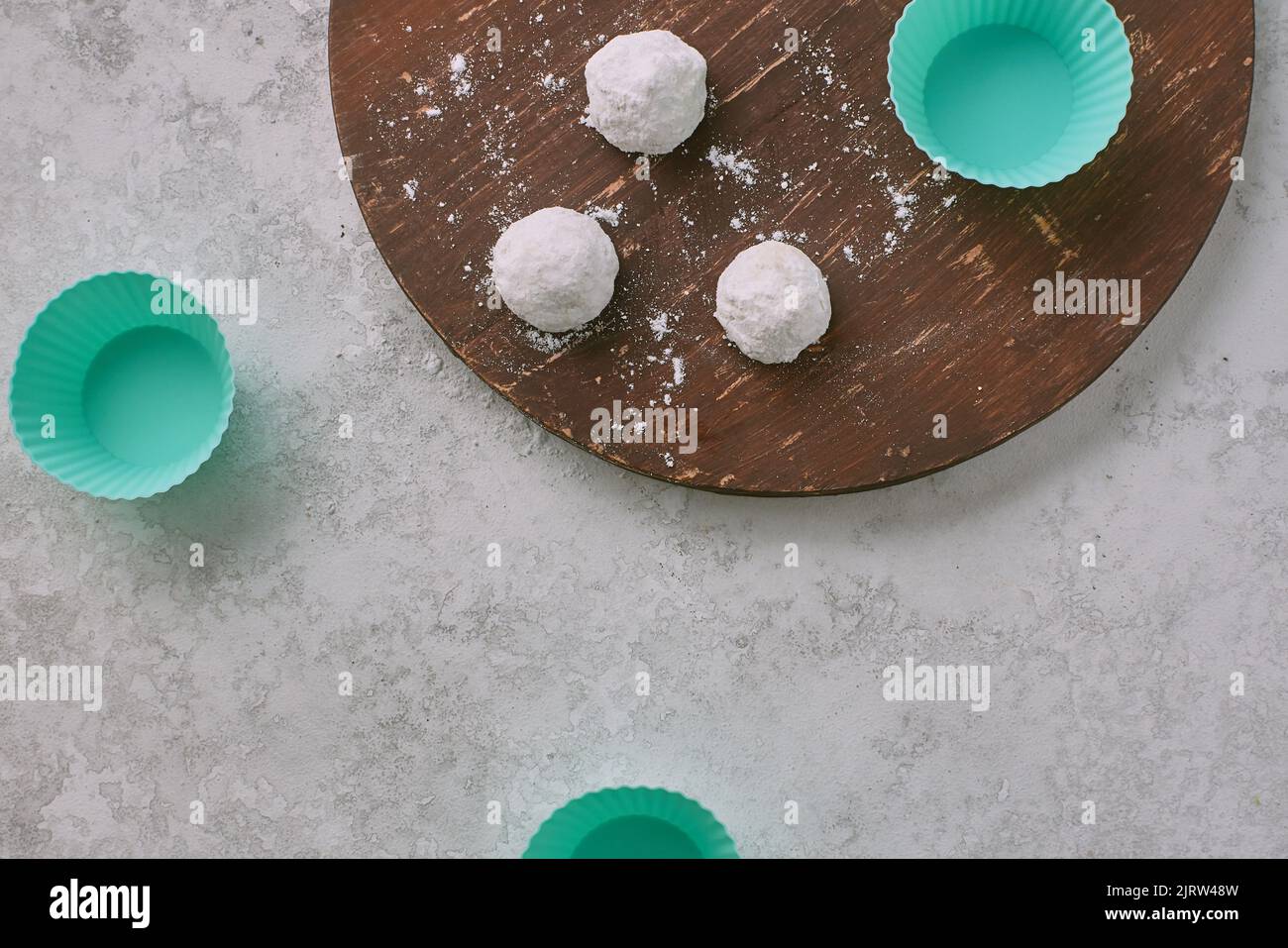 A baking material with cookies on a wooden plate Stock Photo - Alamy