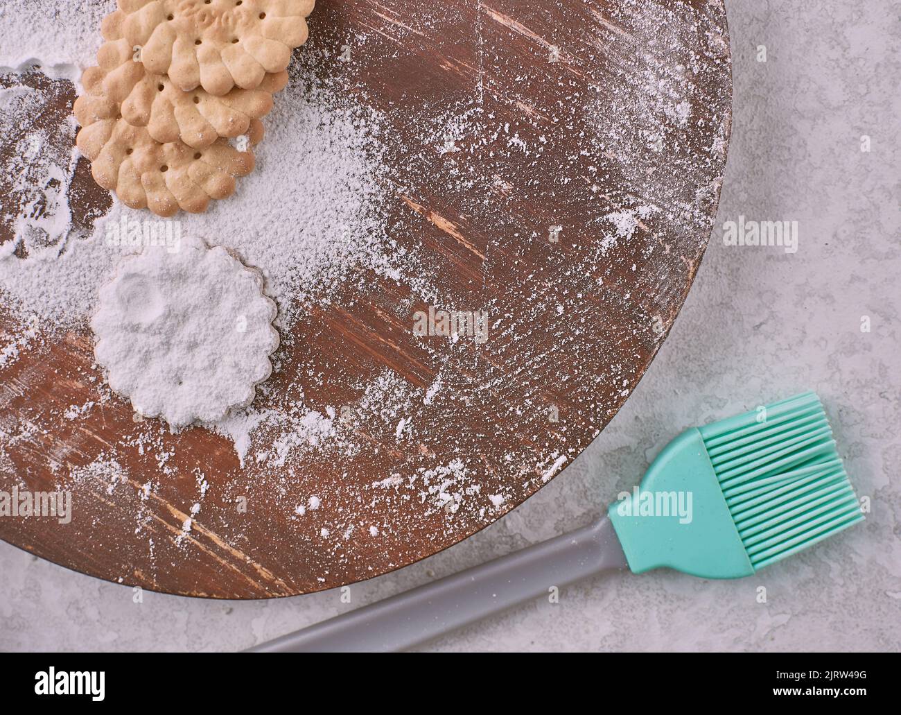 A baking material with cookies on a wooden plate Stock Photo - Alamy