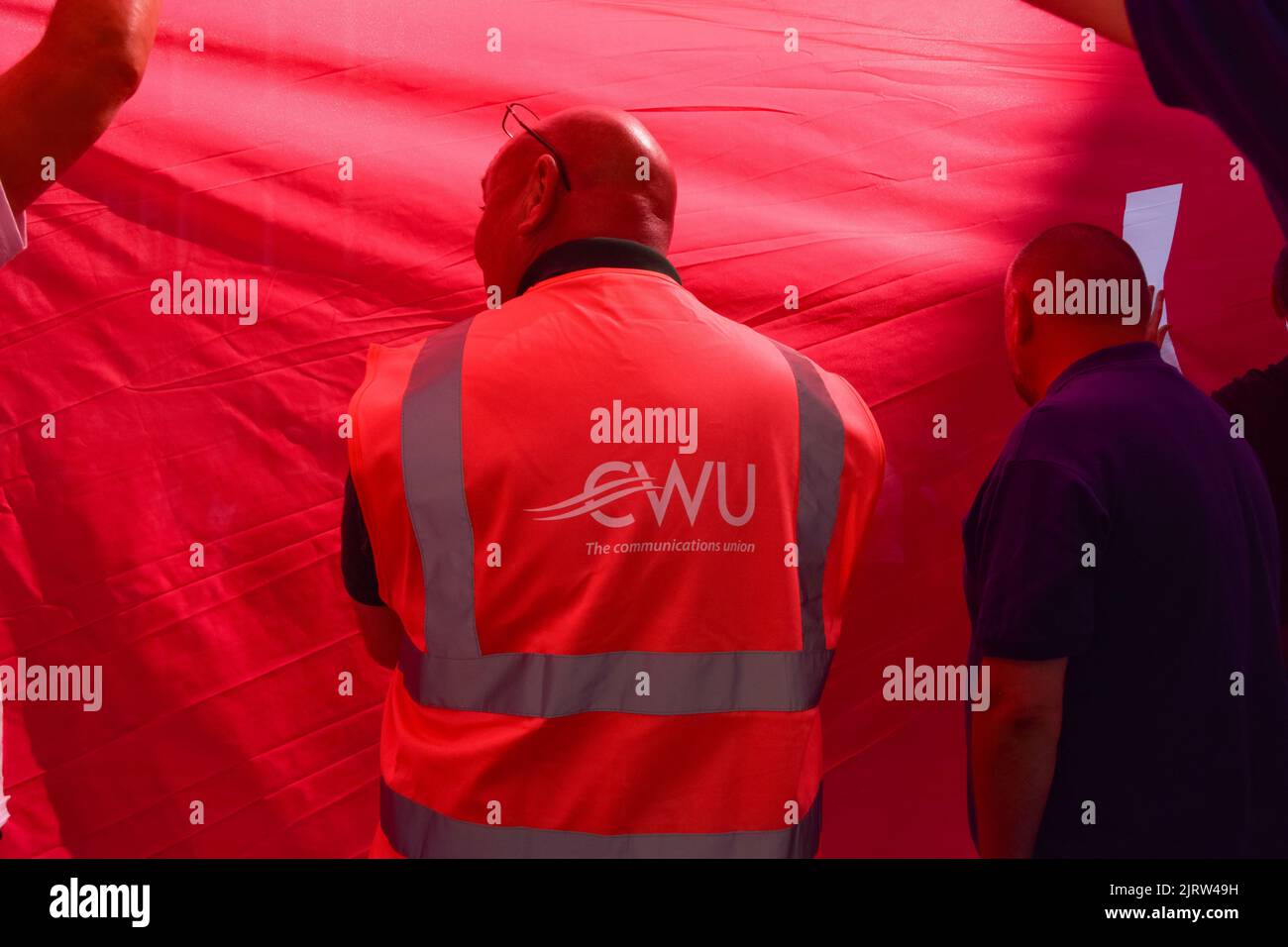 London, England, UK. 26th Aug, 2022. A union member stands under a ...