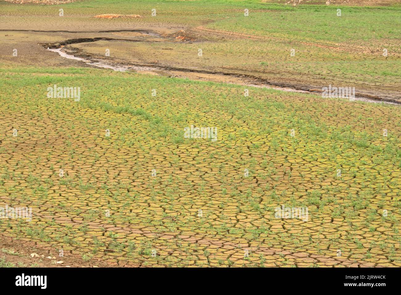 dried up empty reservoir and dam during a summer heatwave, low rainfall ...
