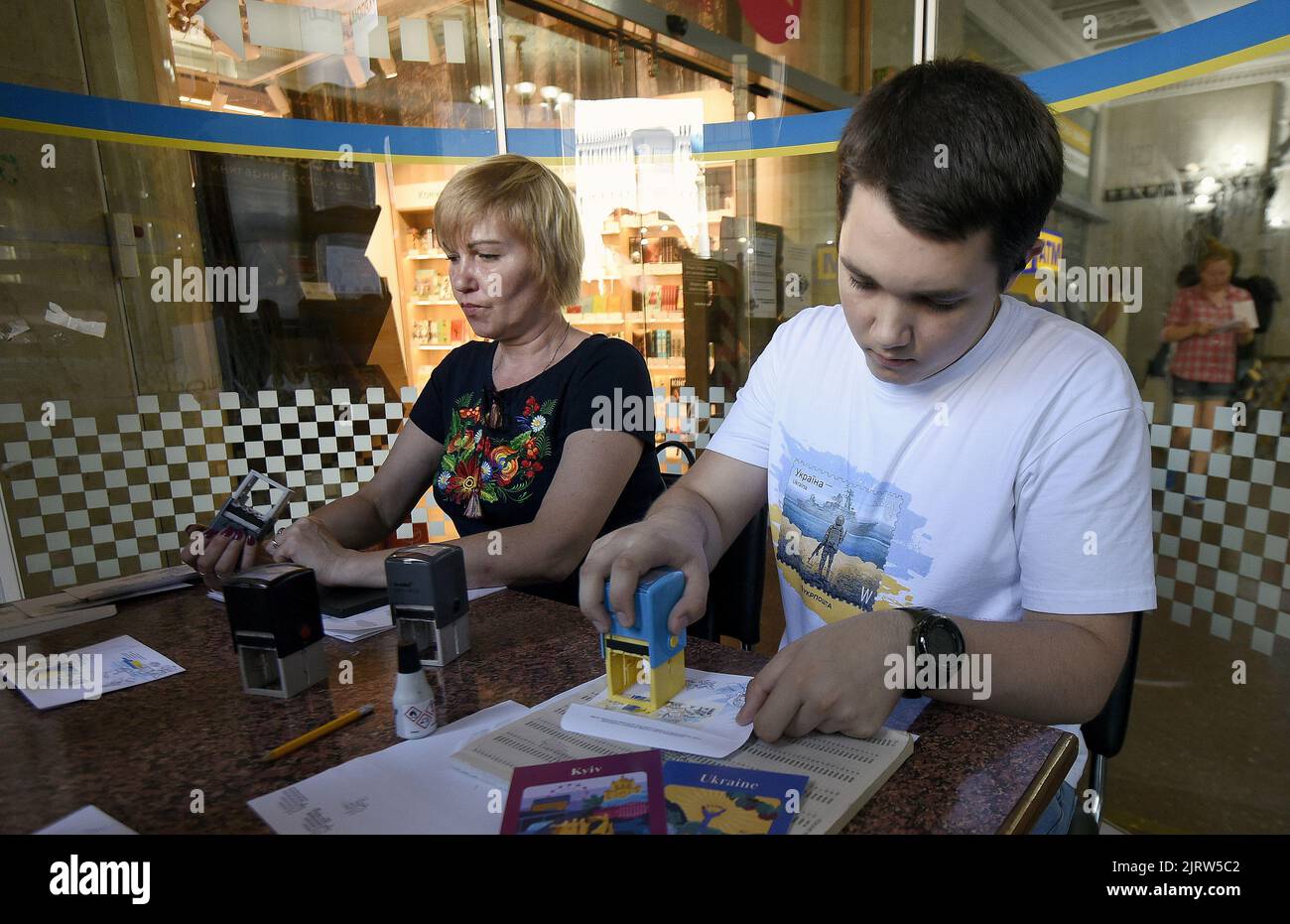 KYIV, UKRAINE - AUGUST 26, 2022 - Employees stamp the envelopes with ...