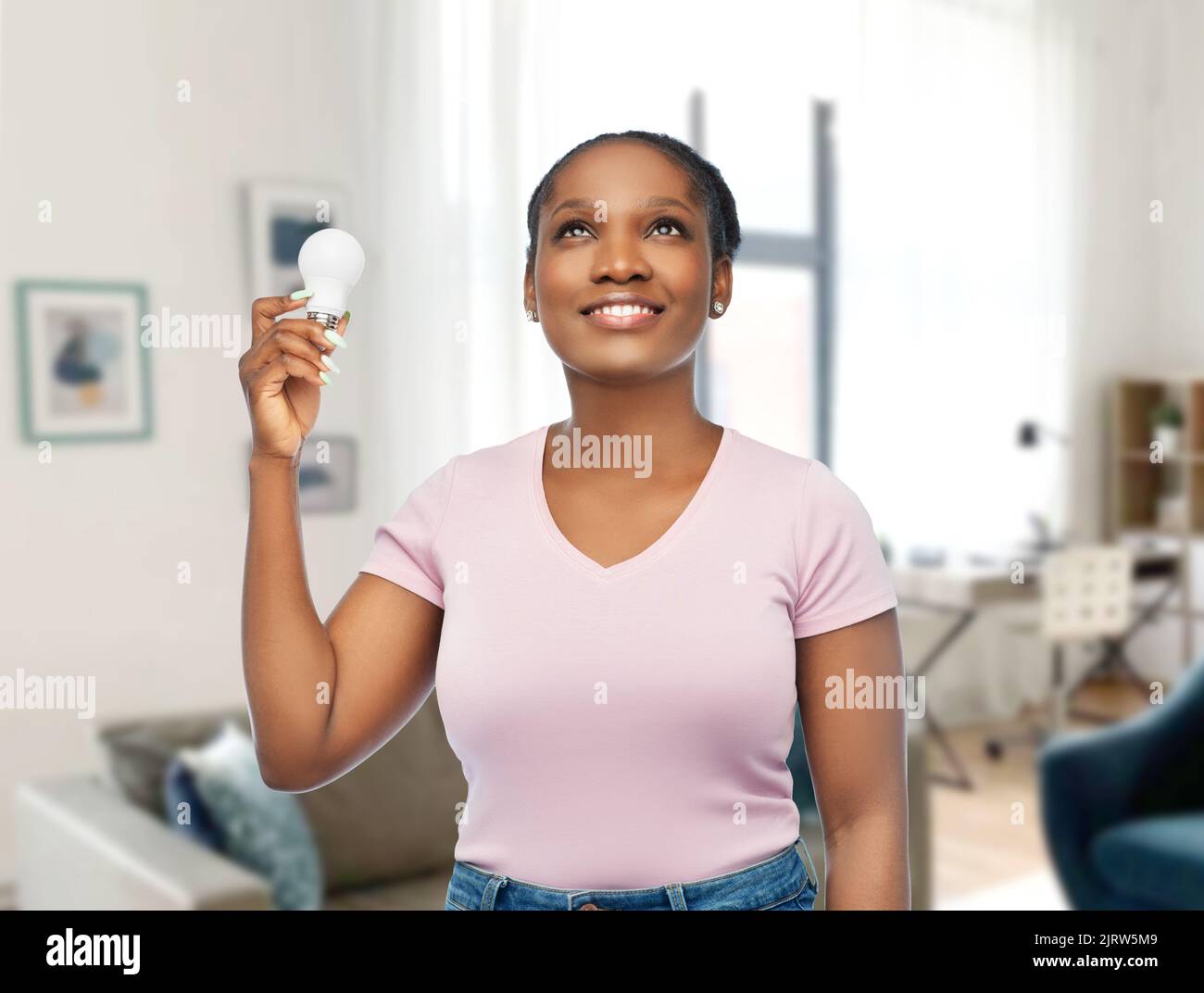 Woman light bulb holding bright hi-res stock photography and images - Alamy