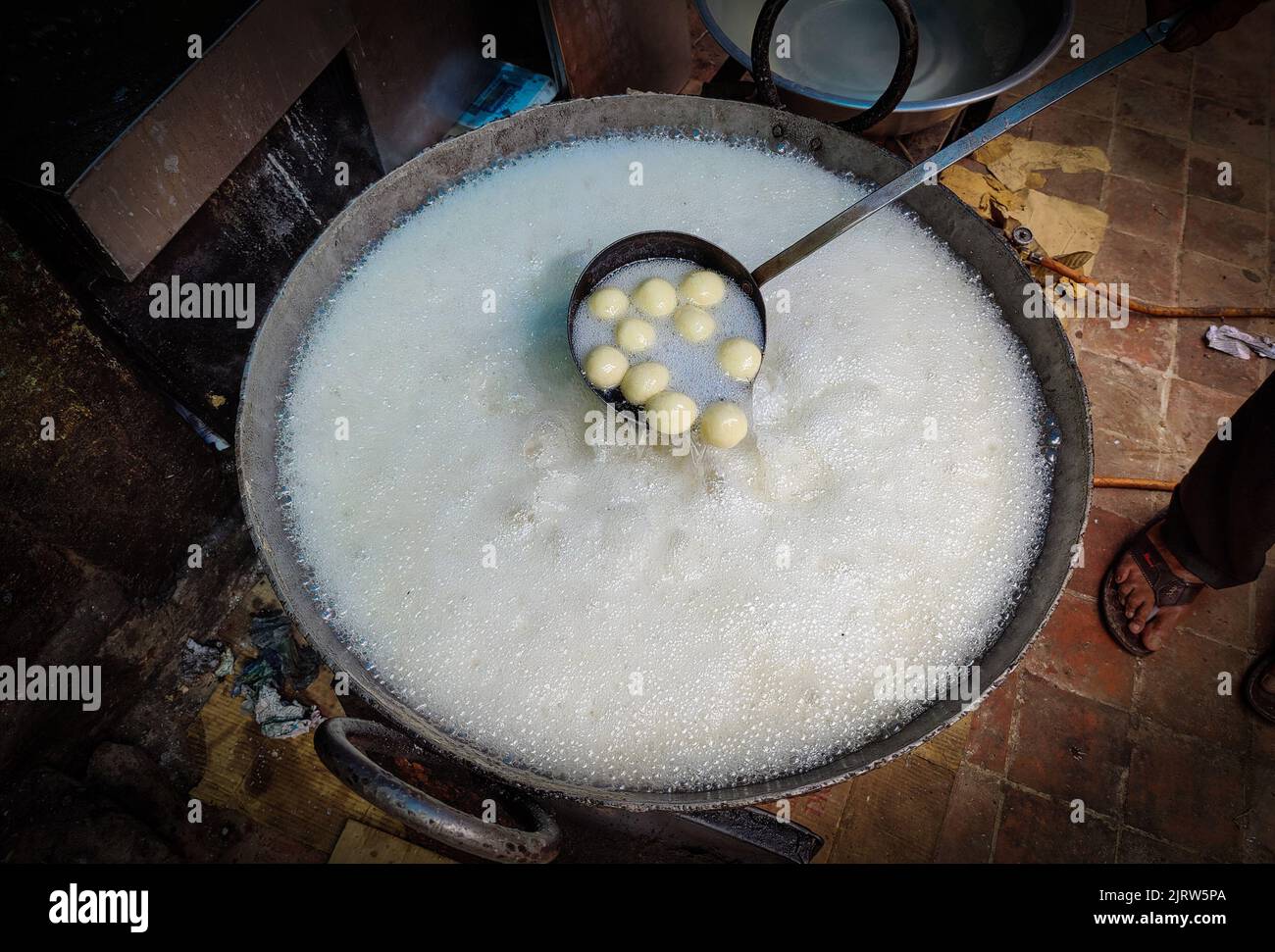 Kathmandu, Bagmati, Nepal. 26th Aug, 2022. A man prepares sweet ...