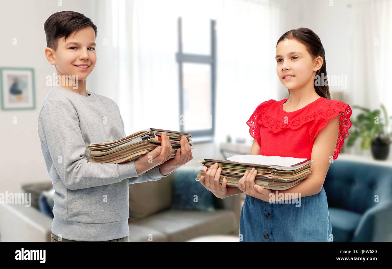 boy and girl with magazines sorting paper waste Stock Photo - Alamy