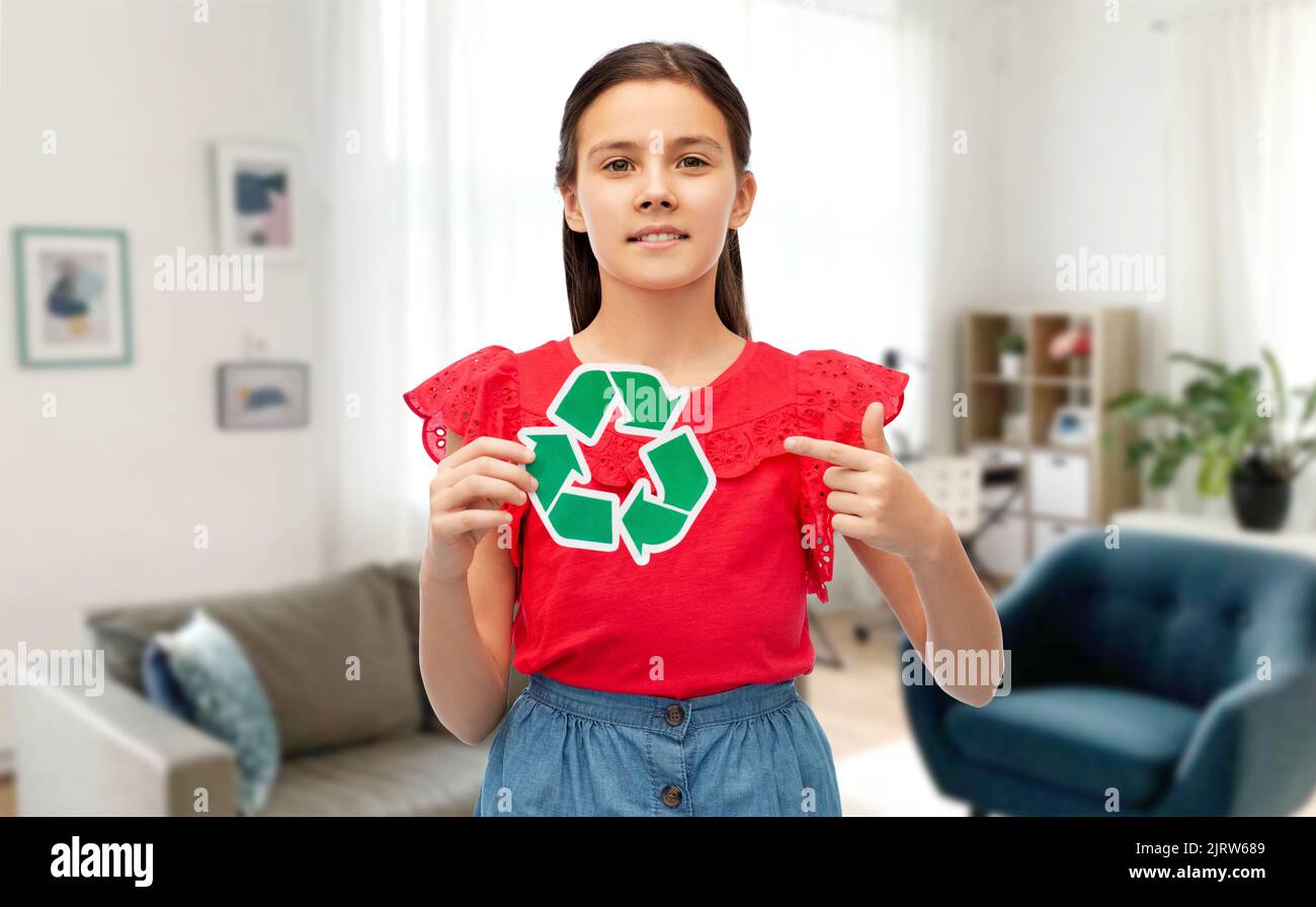 smiling girl showing green recycling sign Stock Photo - Alamy