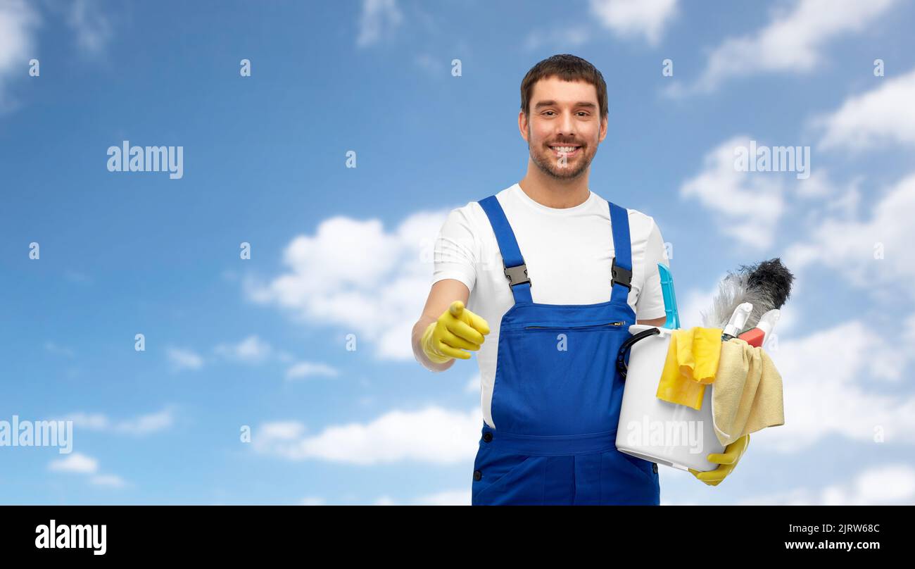 male cleaner in overall with cleaning supplies Stock Photo - Alamy