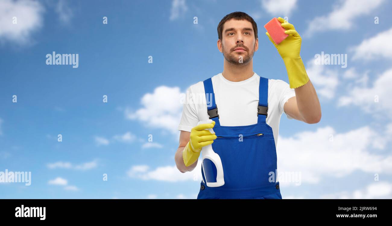 male cleaner cleaning with sponge and detergent Stock Photo - Alamy