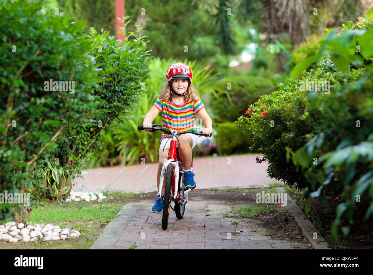 Children going school bicycle in hi-res stock photography and images ...