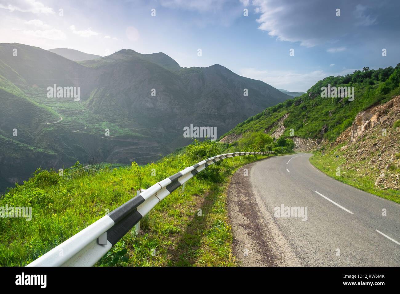 Mountain road landscape in European Alps. Alpine range canyon, green ...