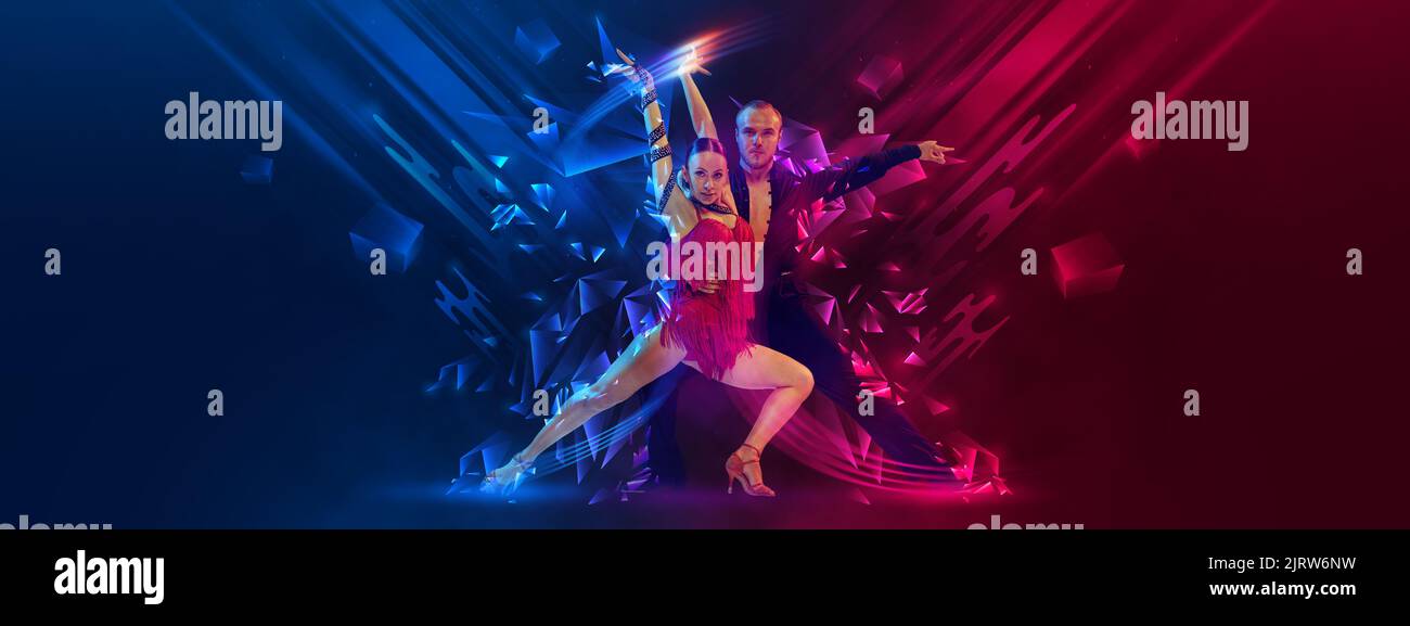 Elegant young couple of dancers dancing samba, cha-cha-cha, rumba, paso ...