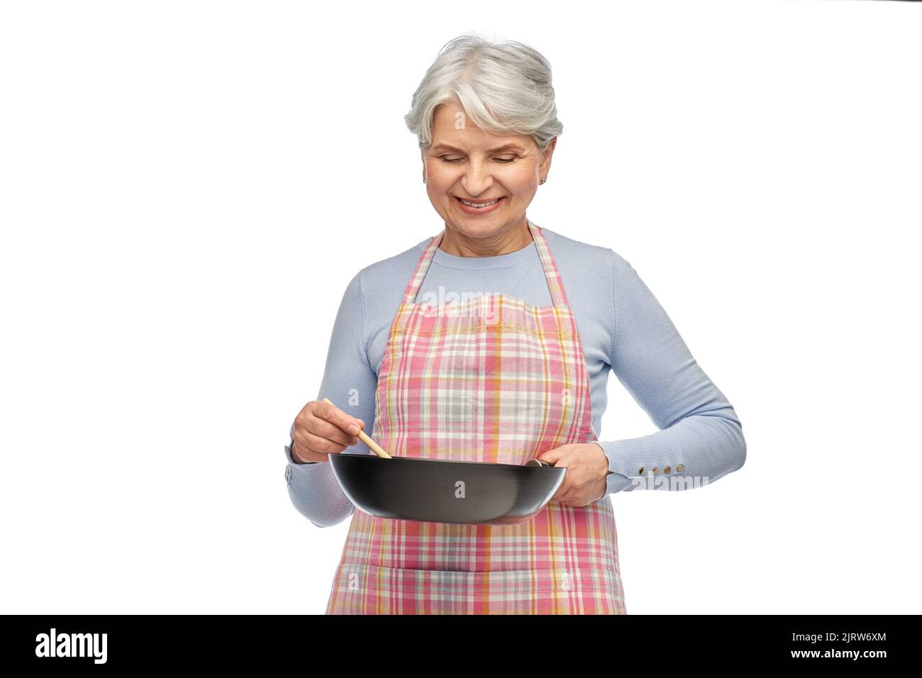 smiling senior woman in apron with frying pan Stock Photo - Alamy
