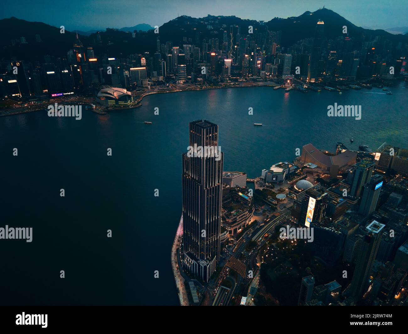 The aerial shot of the Hong Kong city harbor buildings at night Stock ...