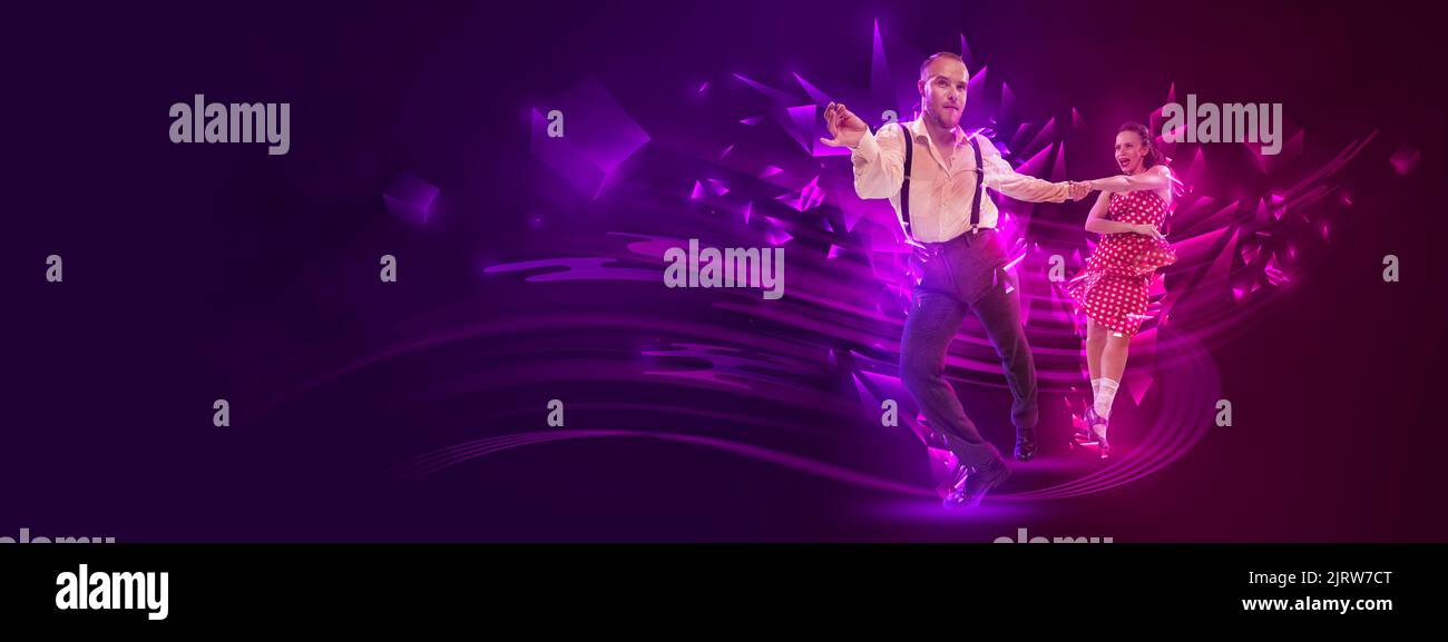 Cheerful, stylish, young couple dancing rock-and -roll, lindy hop over ...