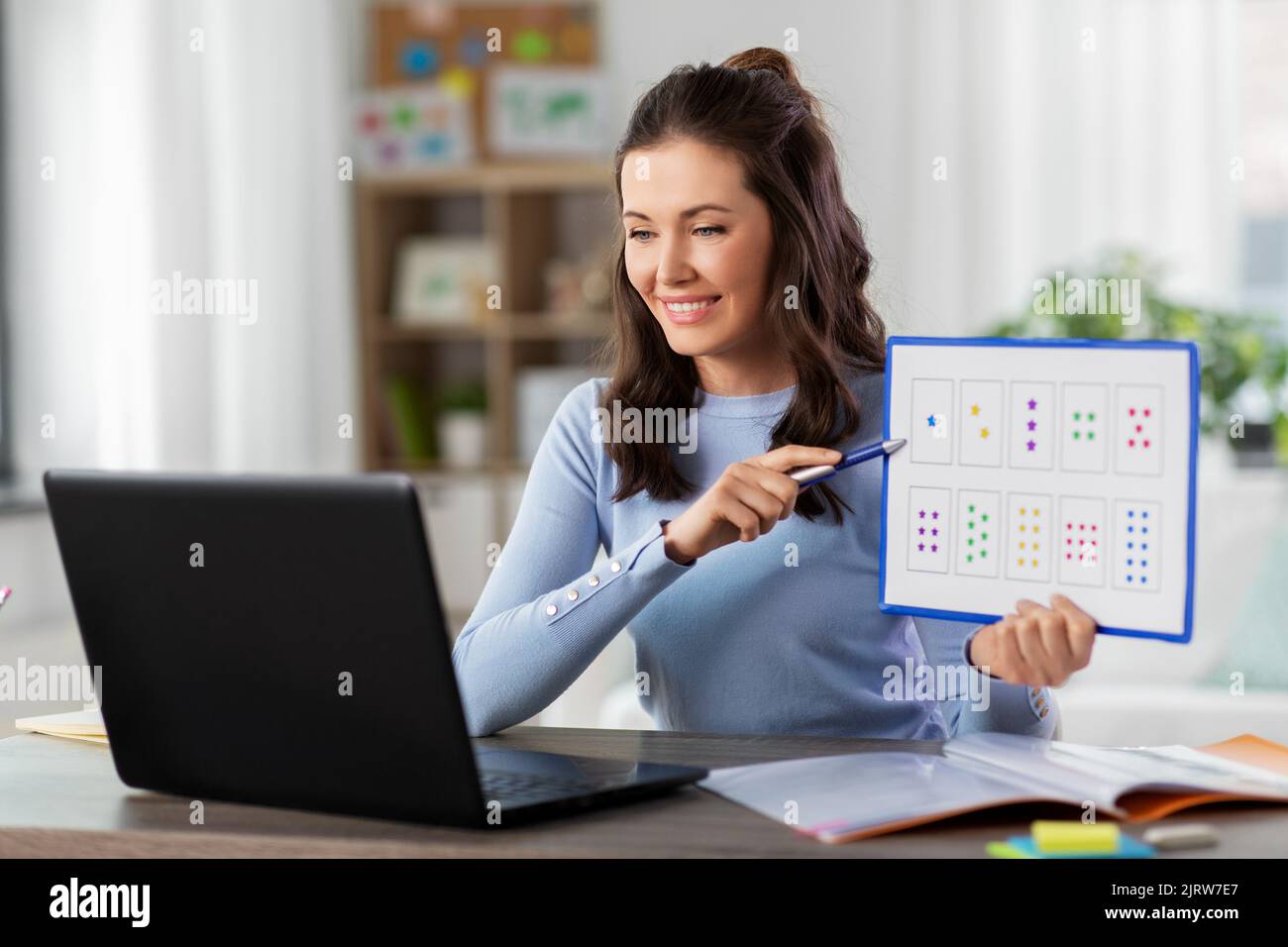 math teacher having online class on laptop at home Stock Photo - Alamy