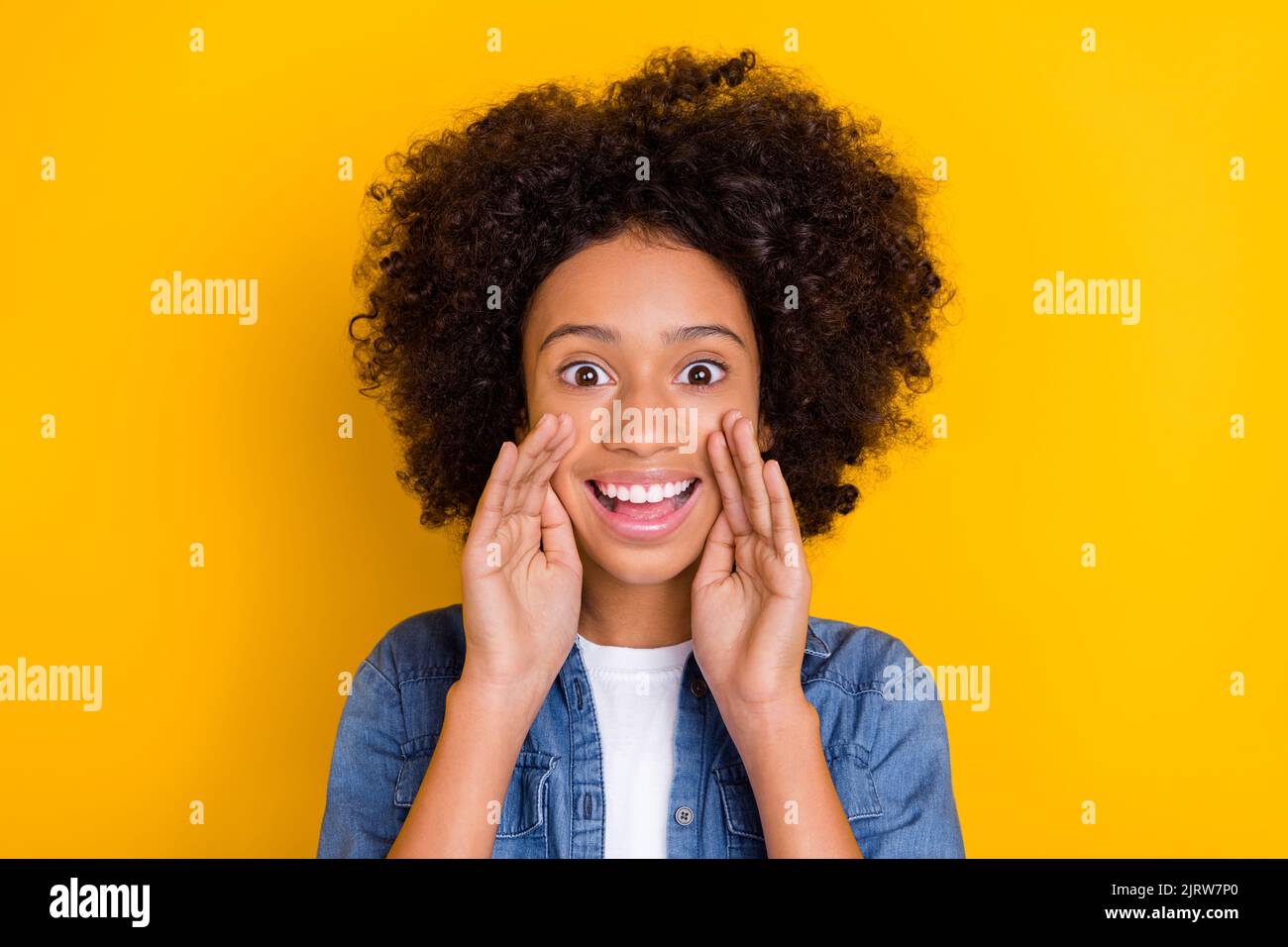 Portrait of attractive cheerful trendy wavy-haired teen girl saying ...