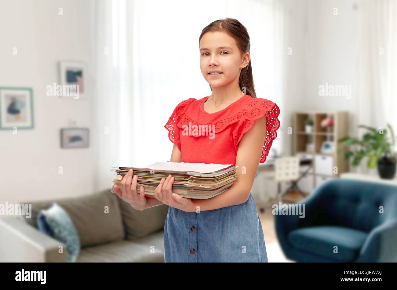 Girl holding stack paper hi-res stock photography and images - Alamy