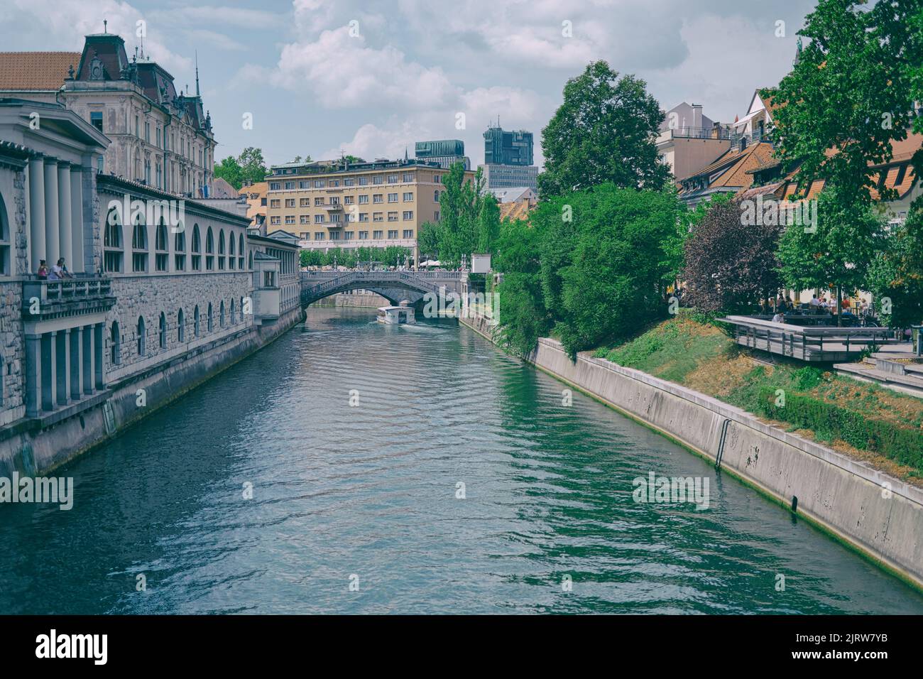 River Ljubljanica bank Triple Bridge in old city center in Ljubljana ...
