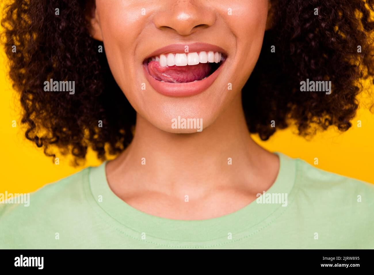 Photo of funny sweet lady wear green t-shirt smiling tongue licking ...