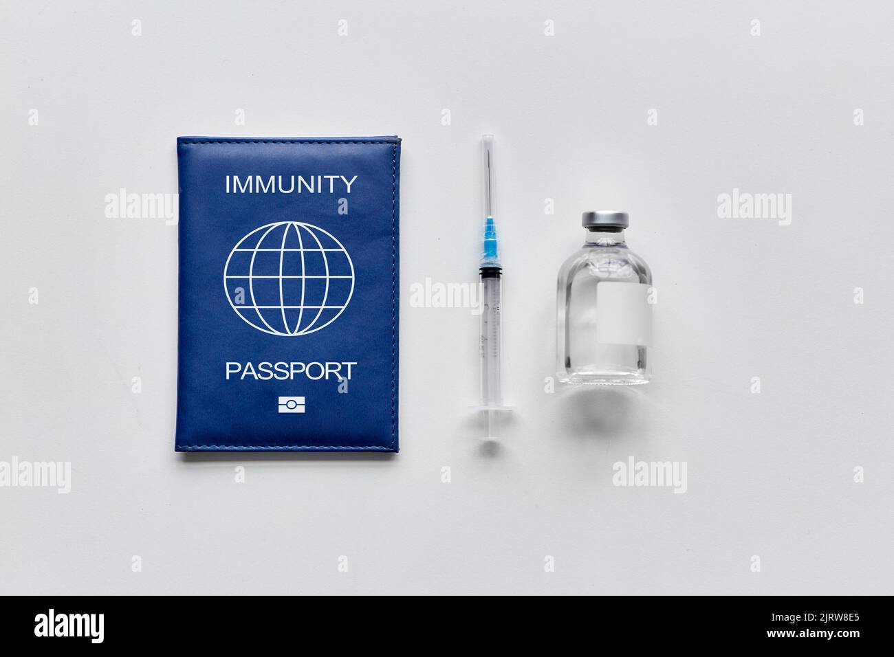 immunity passport, syringe and vaccine on table Stock Photo - Alamy