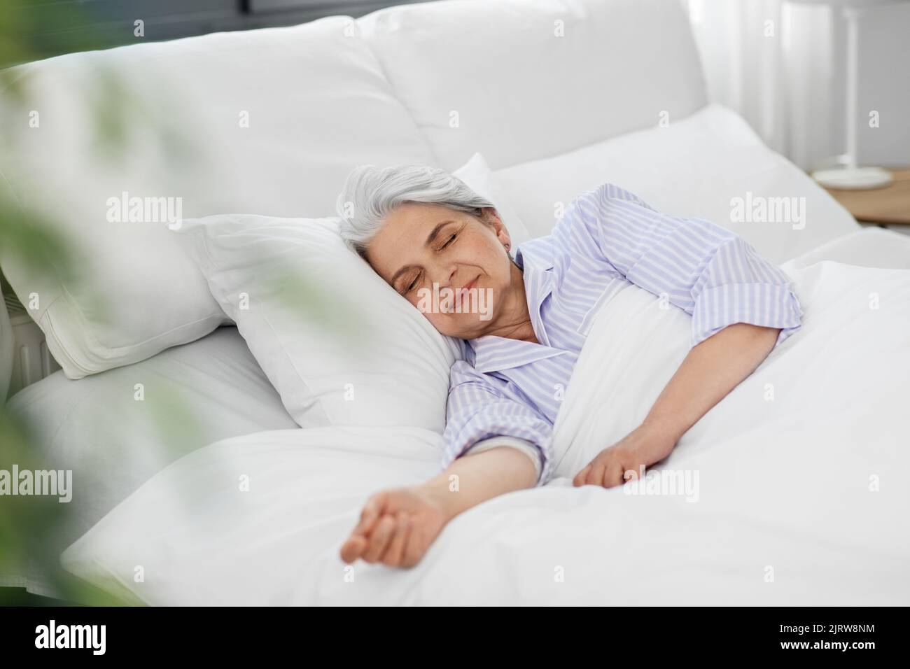 senior woman sleeping in bed at home bedroom Stock Photo - Alamy