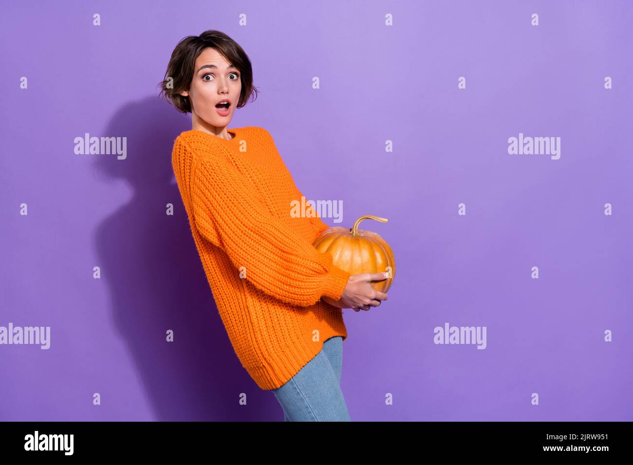 Profile side photo of young pretty woman impressed hold pumpkin ...