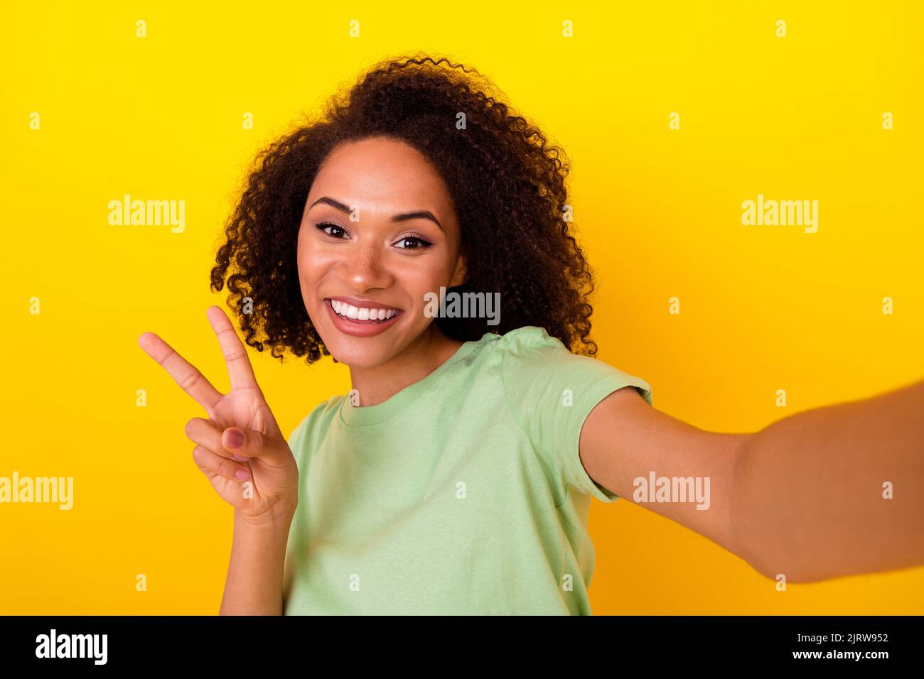 Photo of cheerful positive lady wear green t-shirt recording self video ...