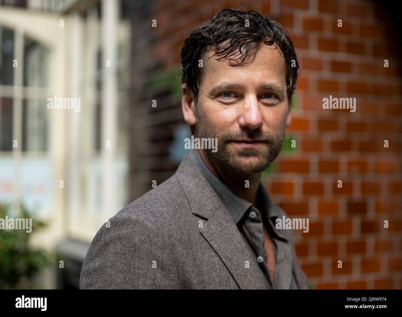 Berlin, Germany. 26th Aug, 2022. Actor Florian Stetter stands in front ...
