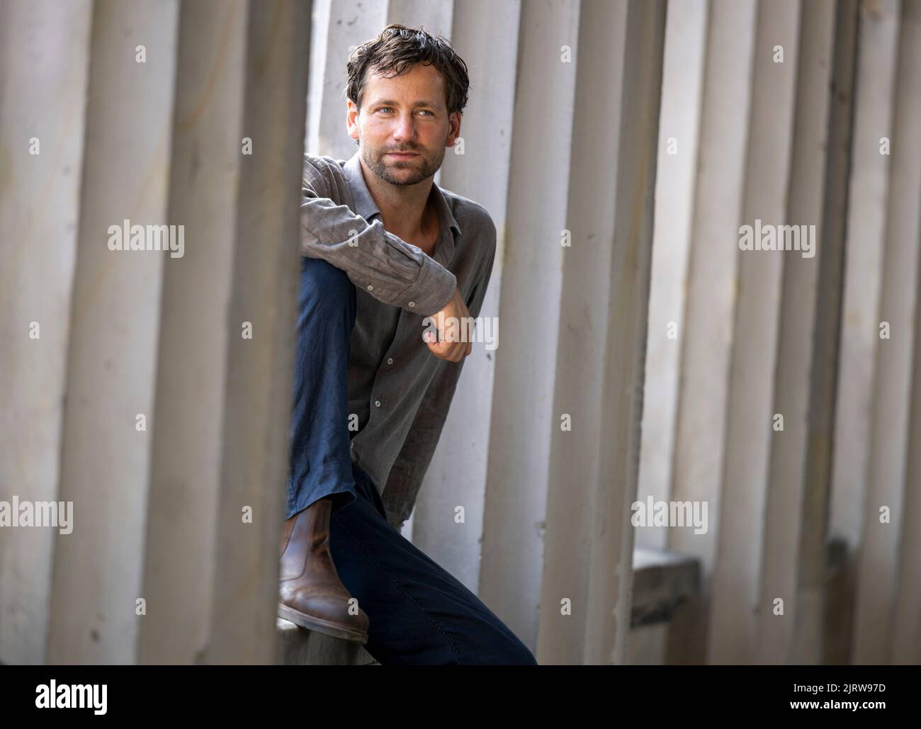 Berlin, Germany. 26th Aug, 2022. Actor Florian Stetter sits at the ...