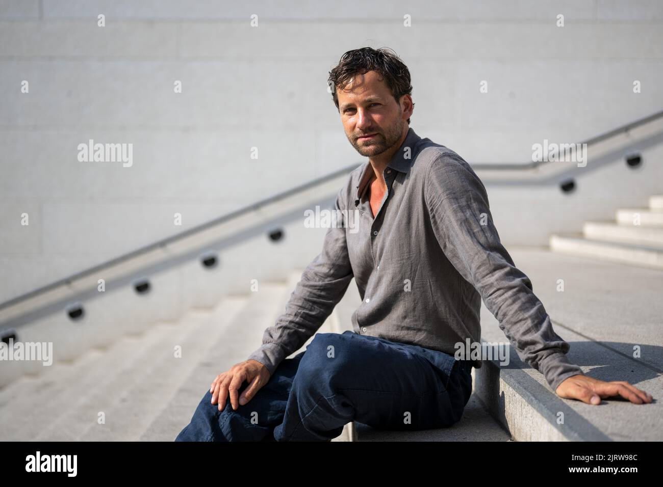 Berlin, Germany. 26th Aug, 2022. Actor Florian Stetter sits on a ...