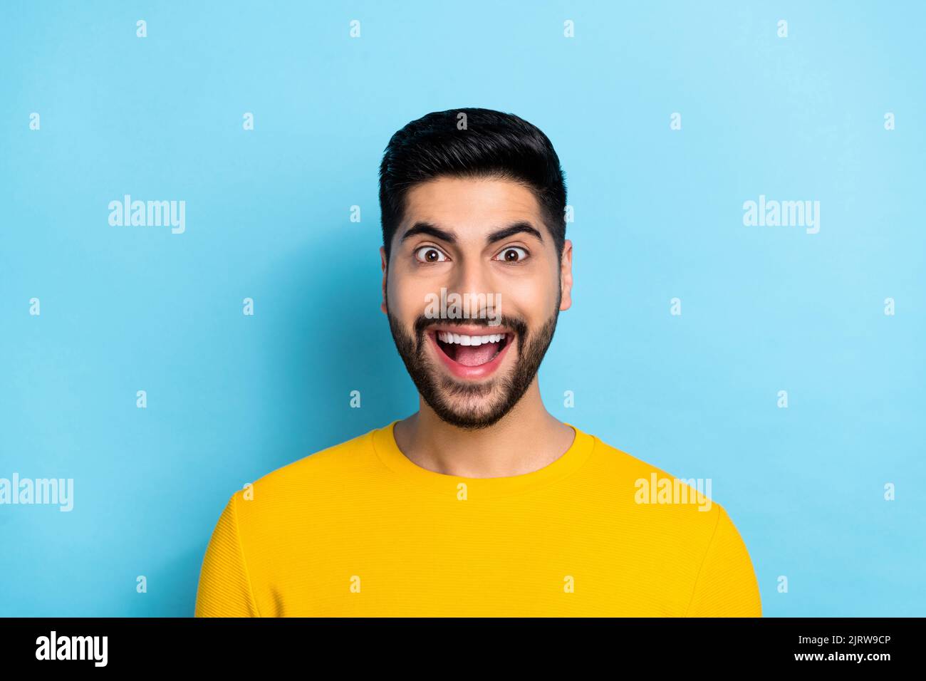 Photo of impressed funky guy dressed yellow pullover smiling open mouth ...