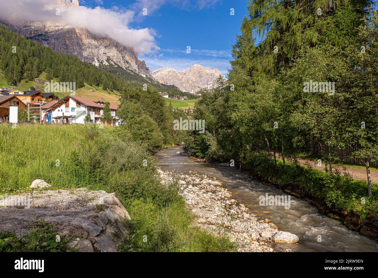 Small Italian village of Alta Badia in a mountain valley of the ...
