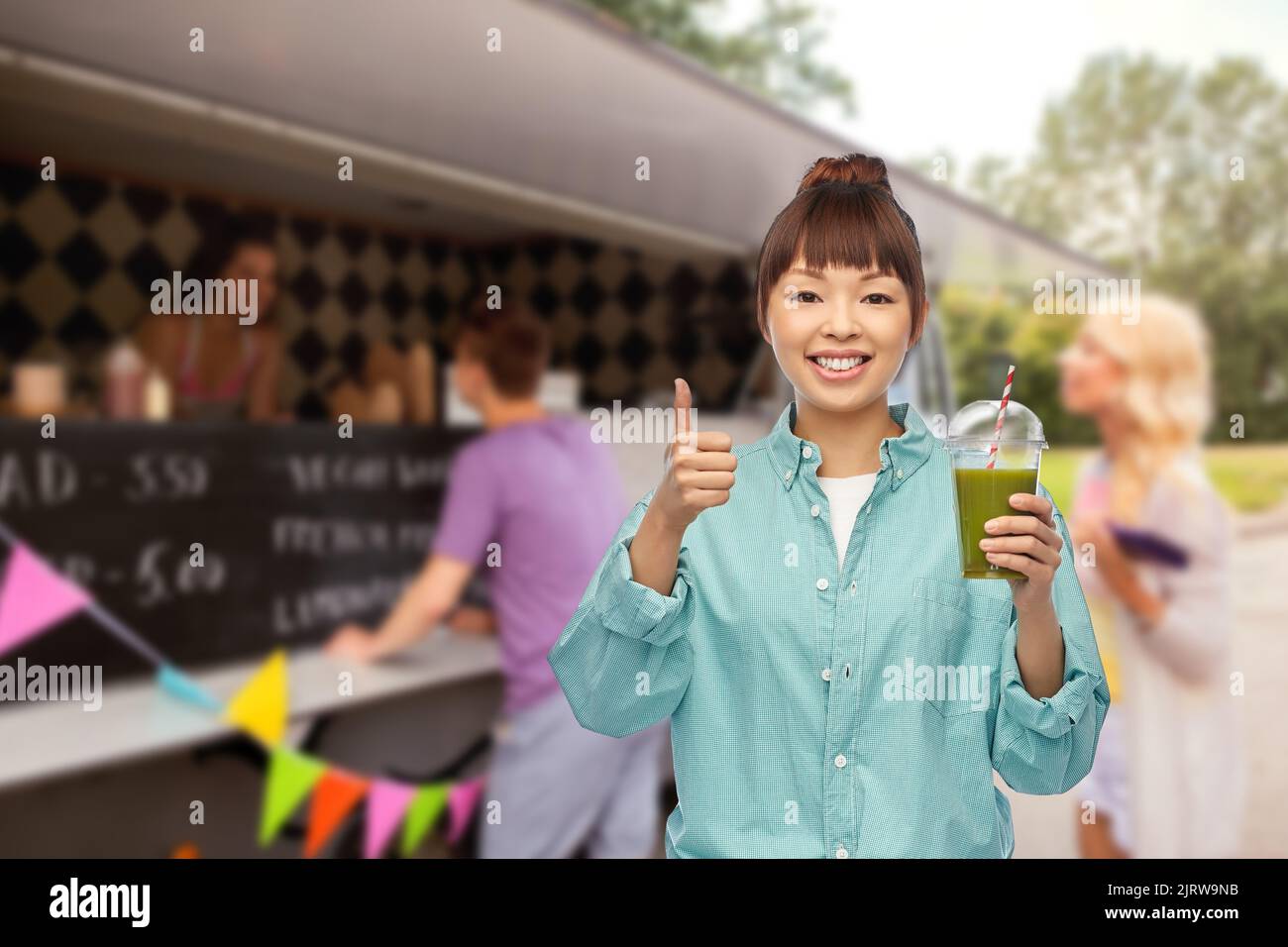 happy asian woman with juice over food truck Stock Photo - Alamy