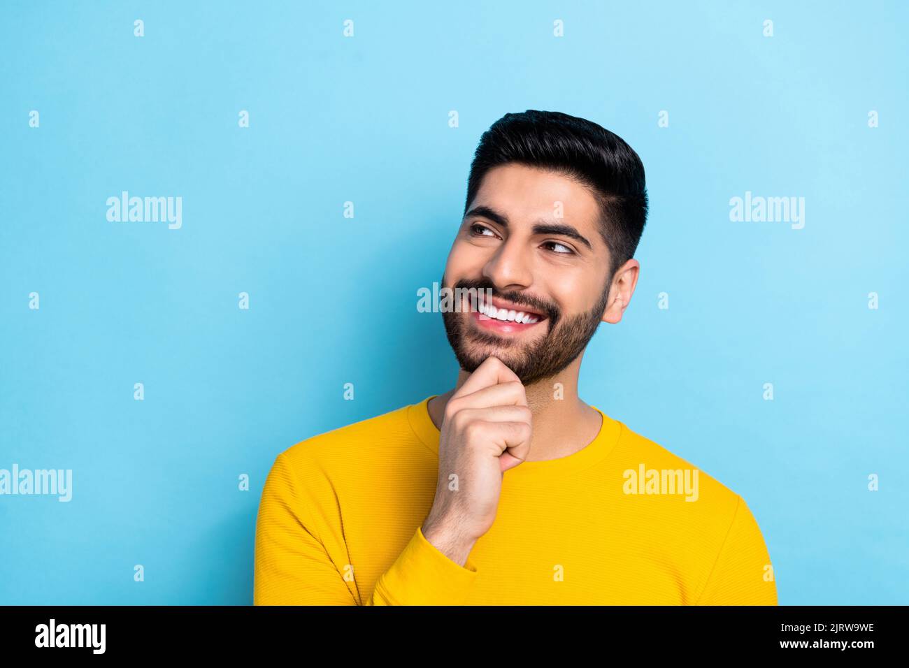Photo of cheerful dreamy guy dressed yellow pullover arm chin looking ...