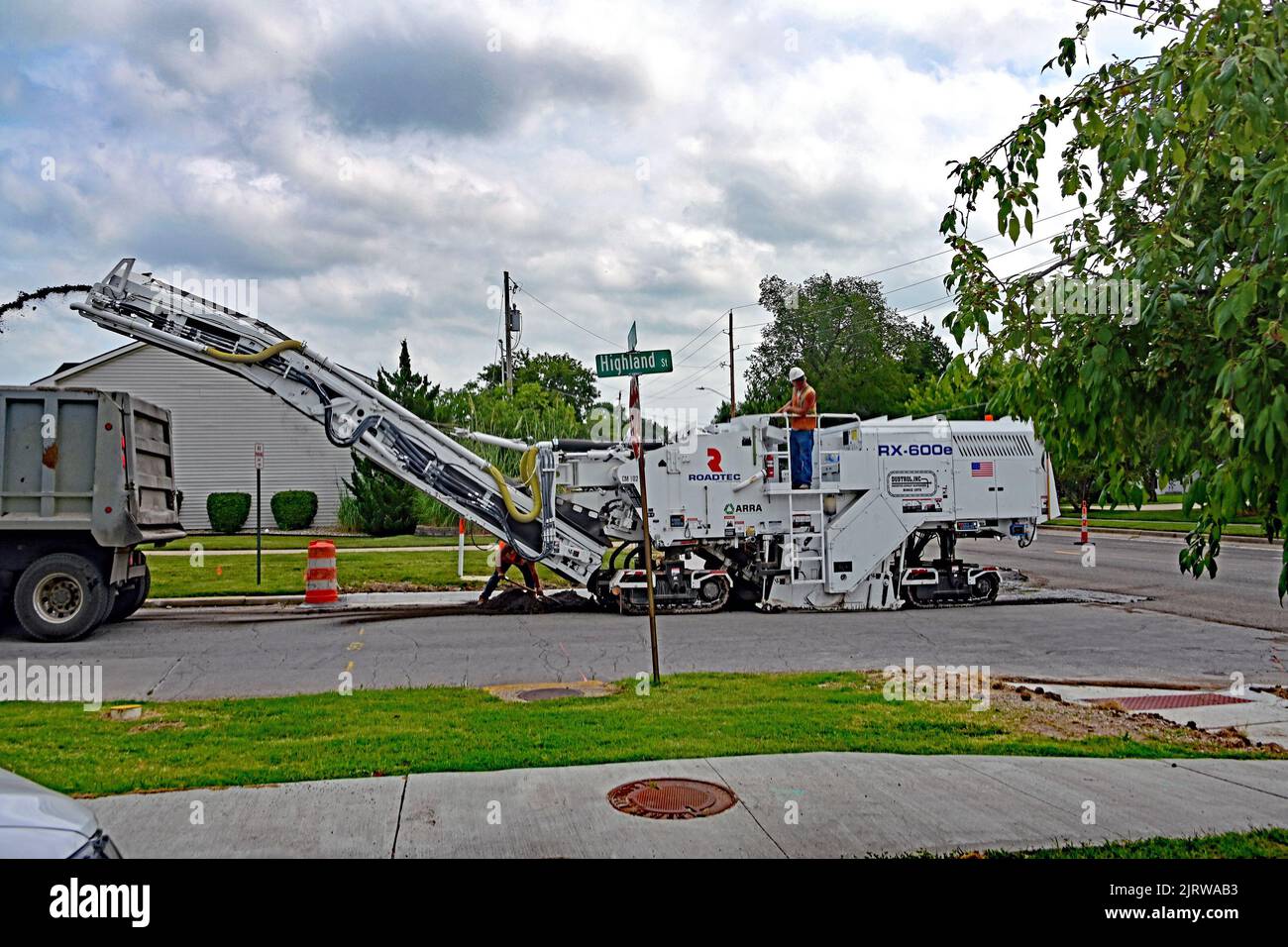 EMPORIA, KANSAS - AUGUST 20, 2021Contractors using a Roadtec RX-600 ...