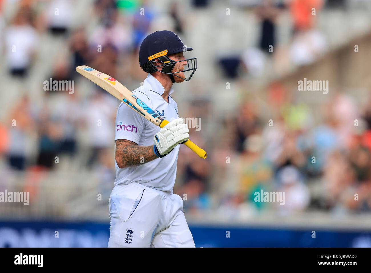 Ben Stokes of England is out for 103 runs and lifts his bat as he walks ...