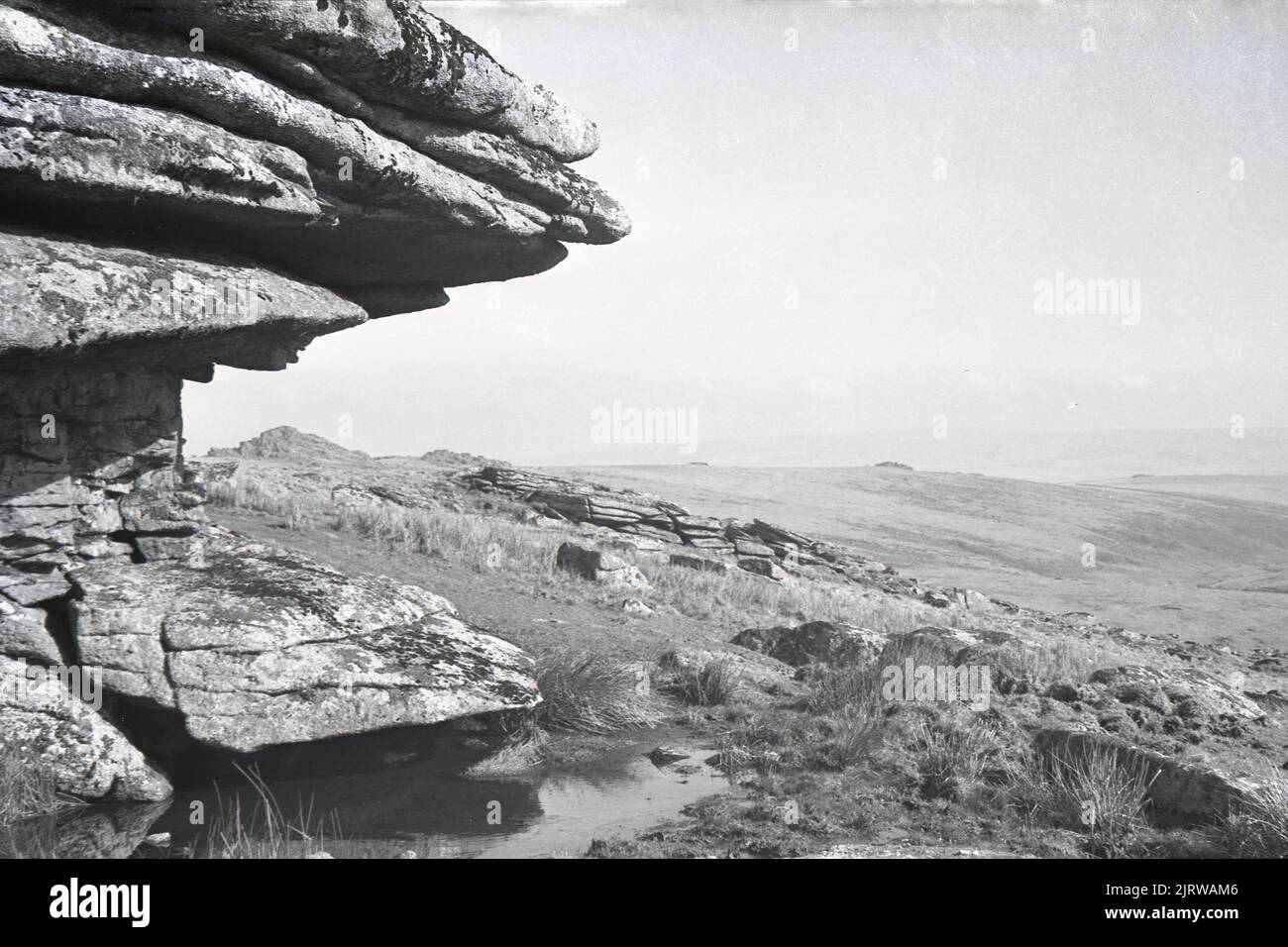1950s, historical, a close-up of a section of granite known as Crow Tor ...