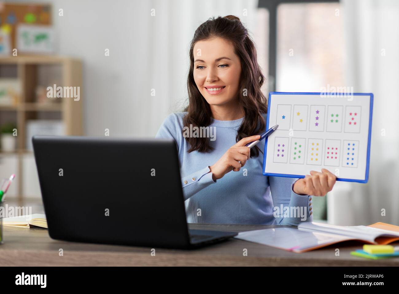 math teacher having online class on laptop at home Stock Photo - Alamy