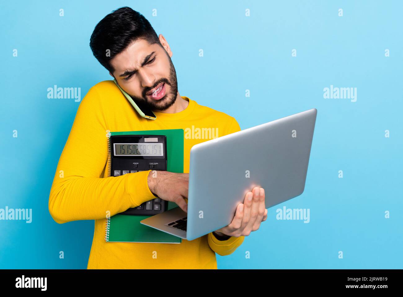 Photo of handsome busy guy dressed yellow pullover working modern ...