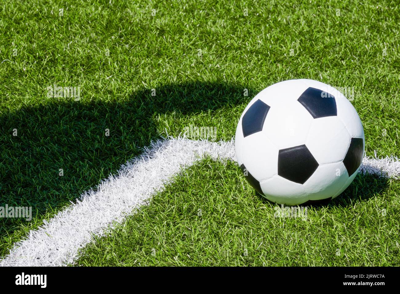 Soccer football sport background. Soccer ball and shadow of player on ...